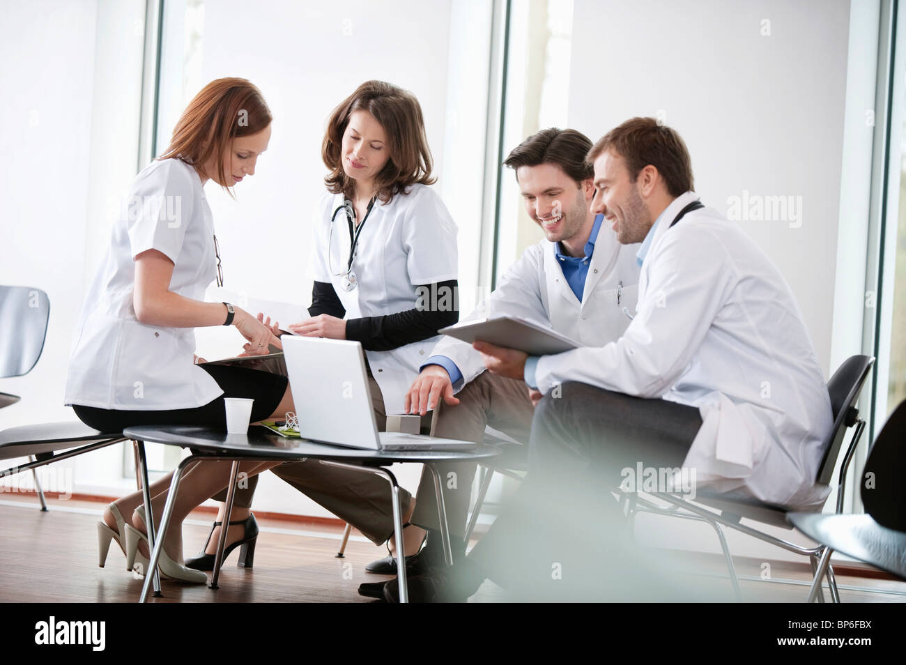 Doctors discussing together Stock Photo - Alamy