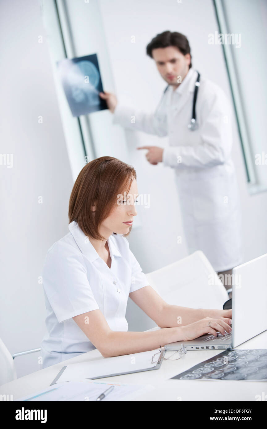 Doctors working in an office Stock Photo - Alamy