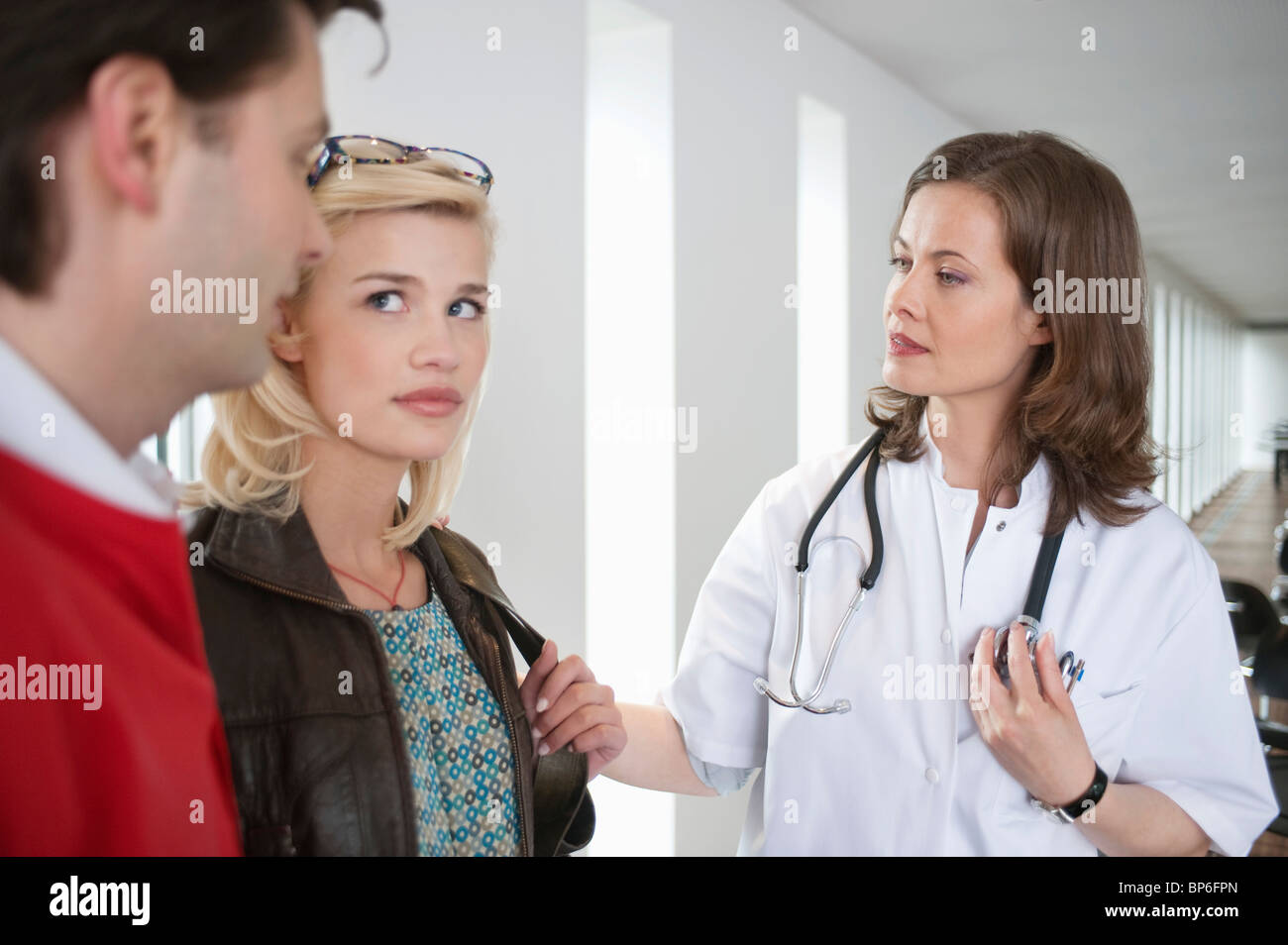Female doctor consoling a patient Stock Photo - Alamy