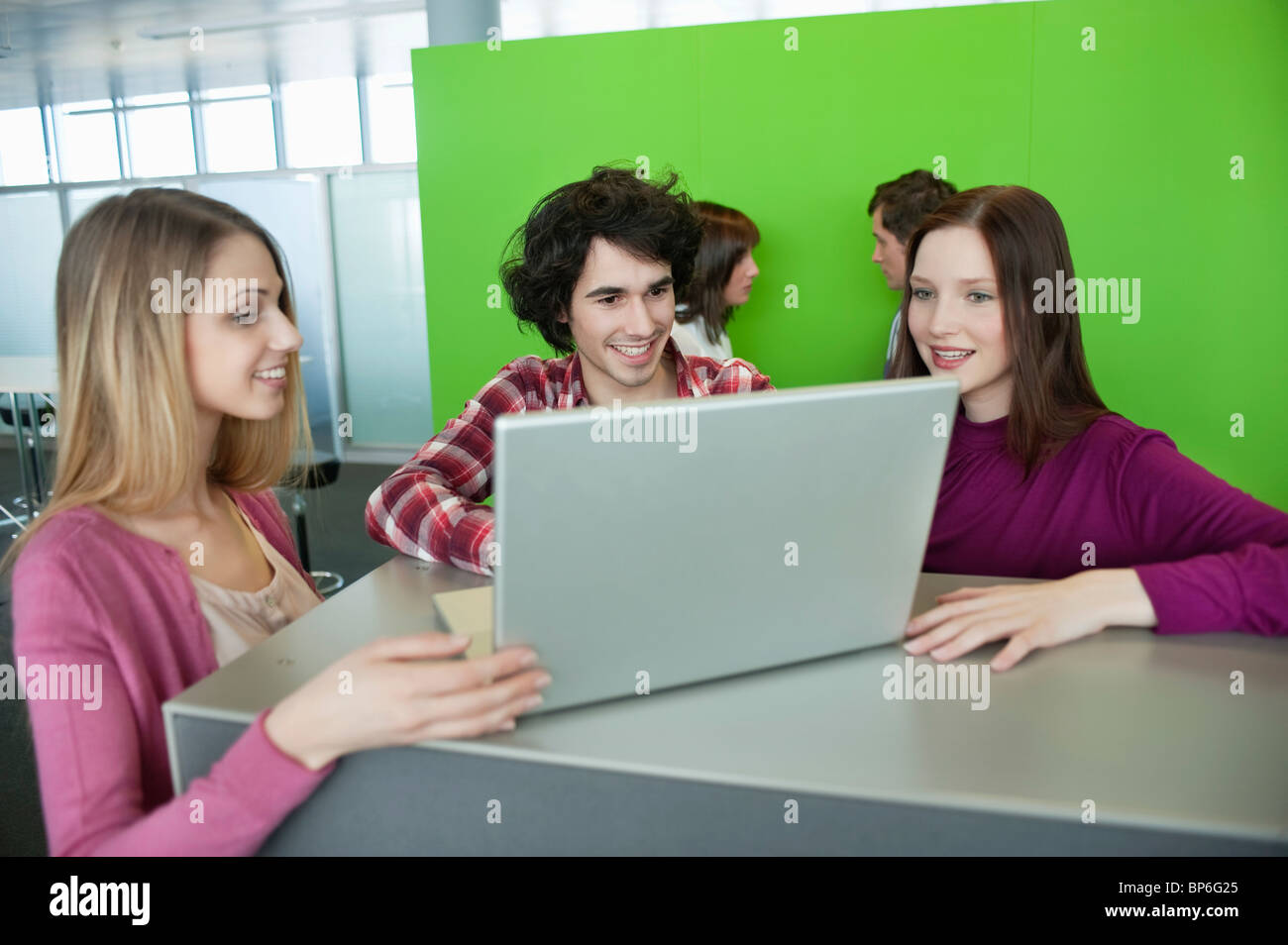 Colleagues using horizontal green hi-res stock photography and images ...