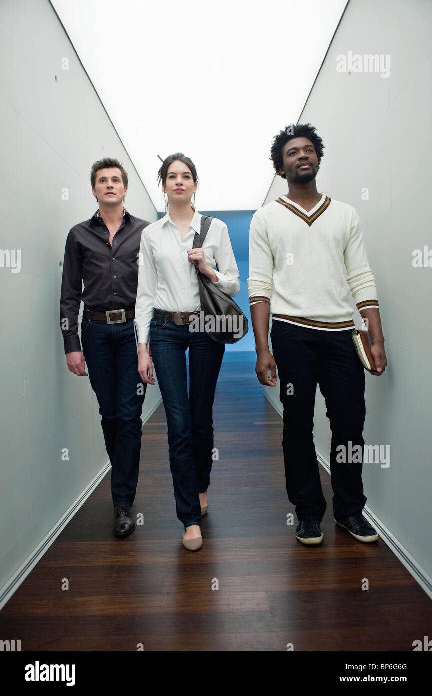 Business executives walking in the corridor of an office Stock Photo ...