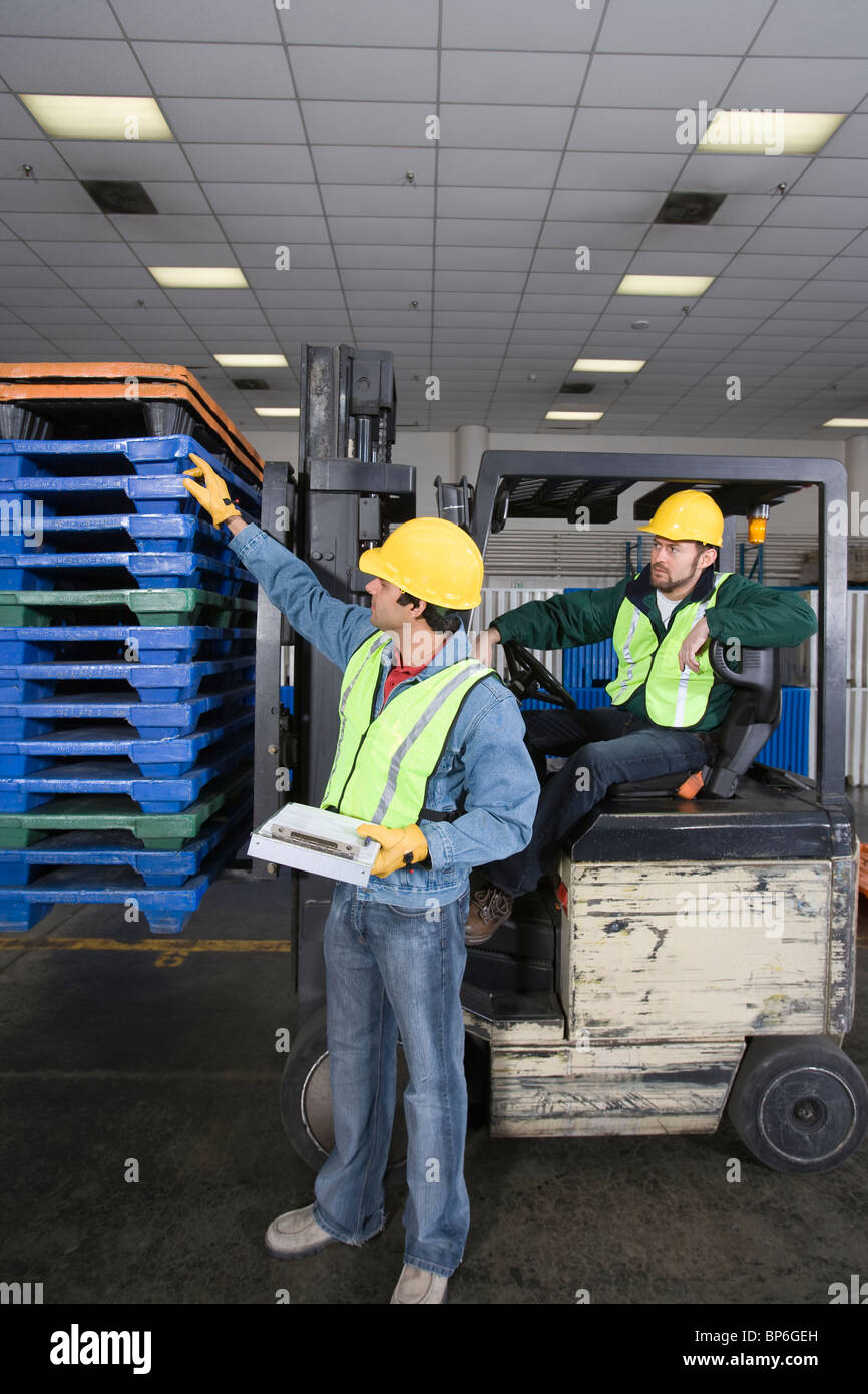 Men working in factory Stock Photo - Alamy