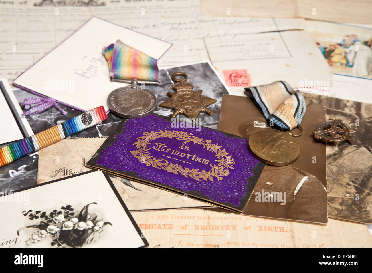 A collection of family documents and photographs being used to research ...