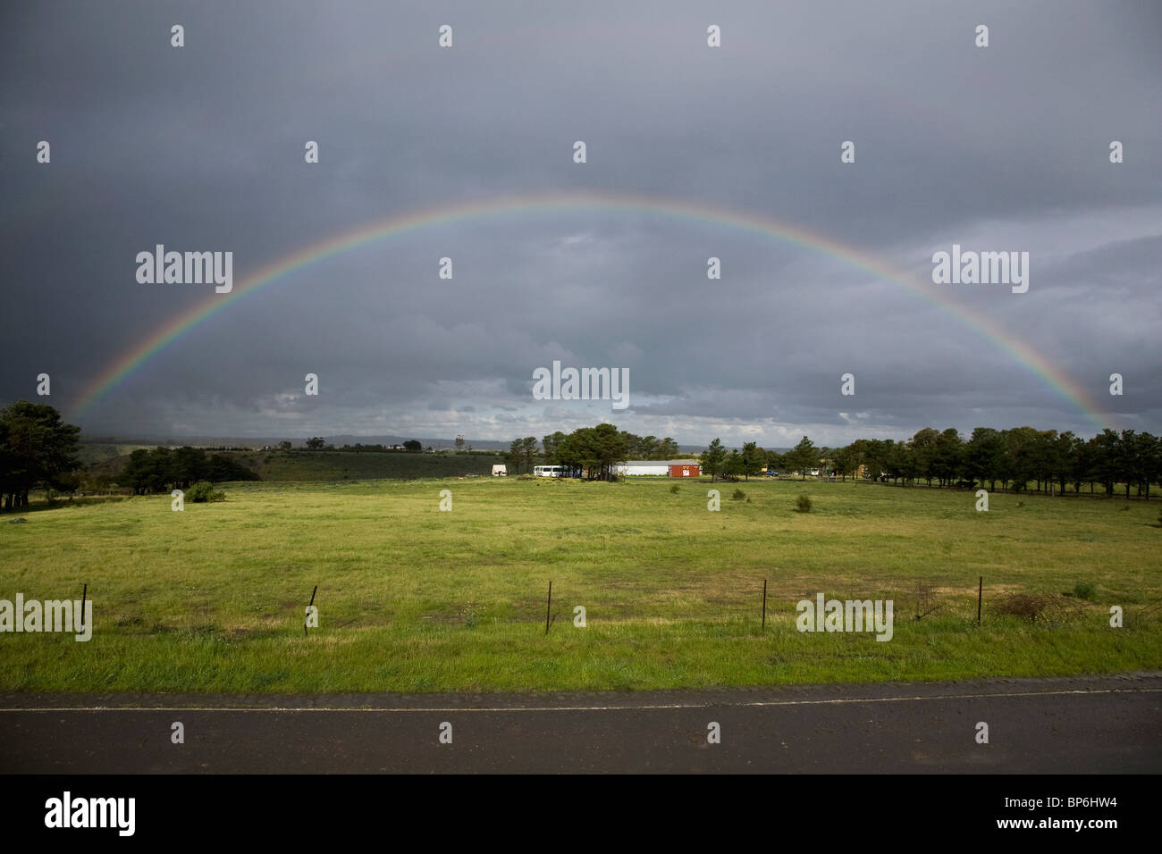 A rainbow in the sky over a rural setting Stock Photo - Alamy