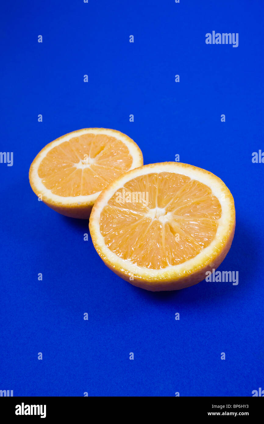 Two orange halves Stock Photo - Alamy