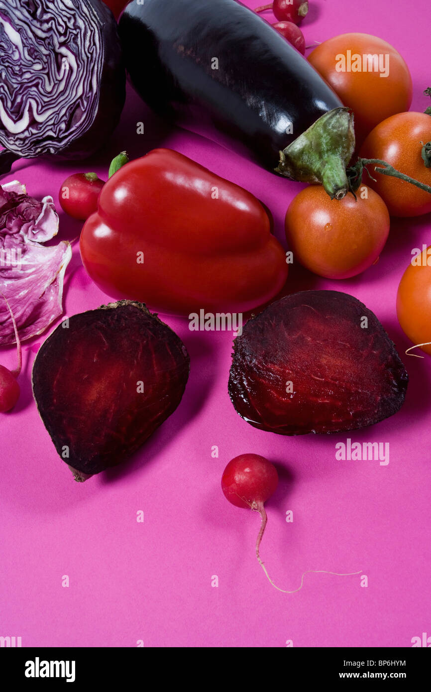 Arrangement of red and purple vegetables on a pink background Stock ...