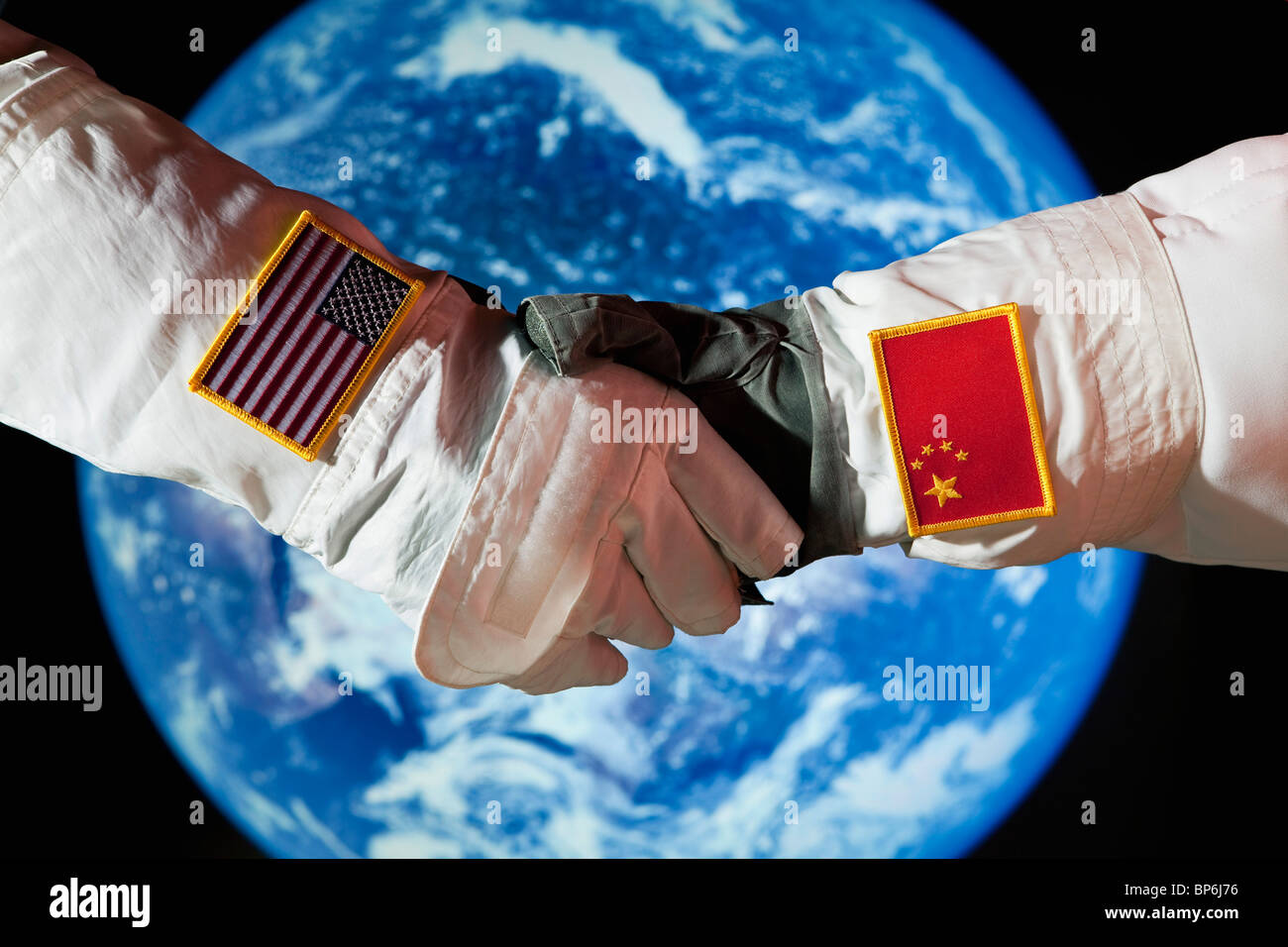 An American astronaut shaking hands with a Chinese astronaut Stock ...