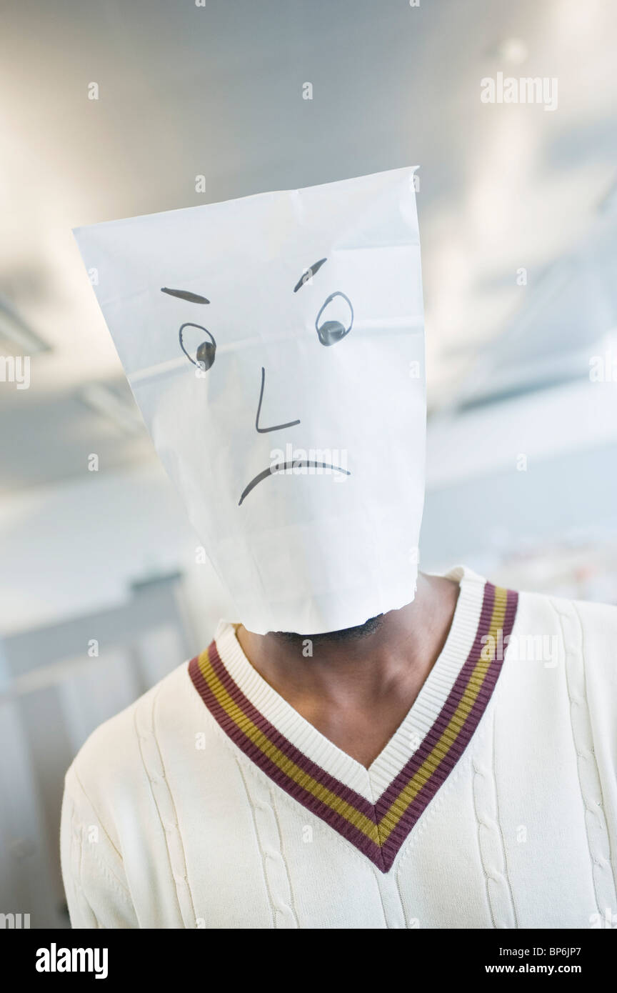 Businessman wearing a paper bag of sad face Stock Photo - Alamy