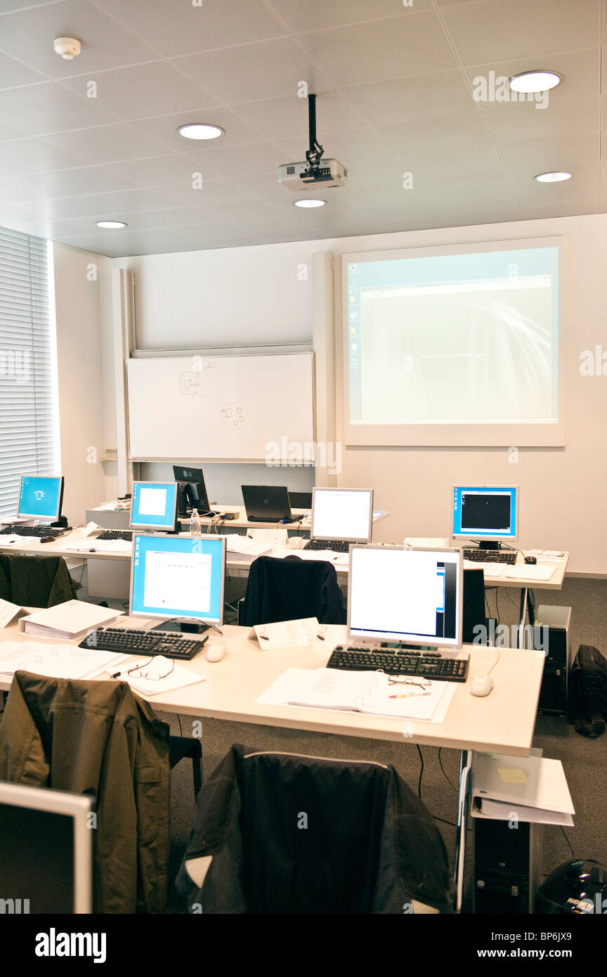 Computers on tables in a classroom Stock Photo - Alamy