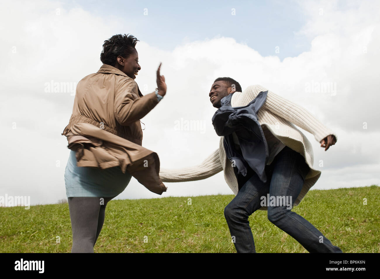 Women chasing man hi-res stock photography and images - Alamy