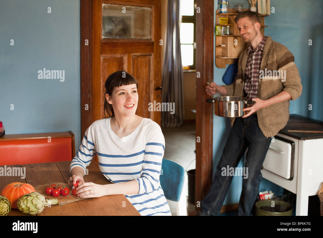 A couple cooking in a domestic kitchen Stock Photo - Alamy