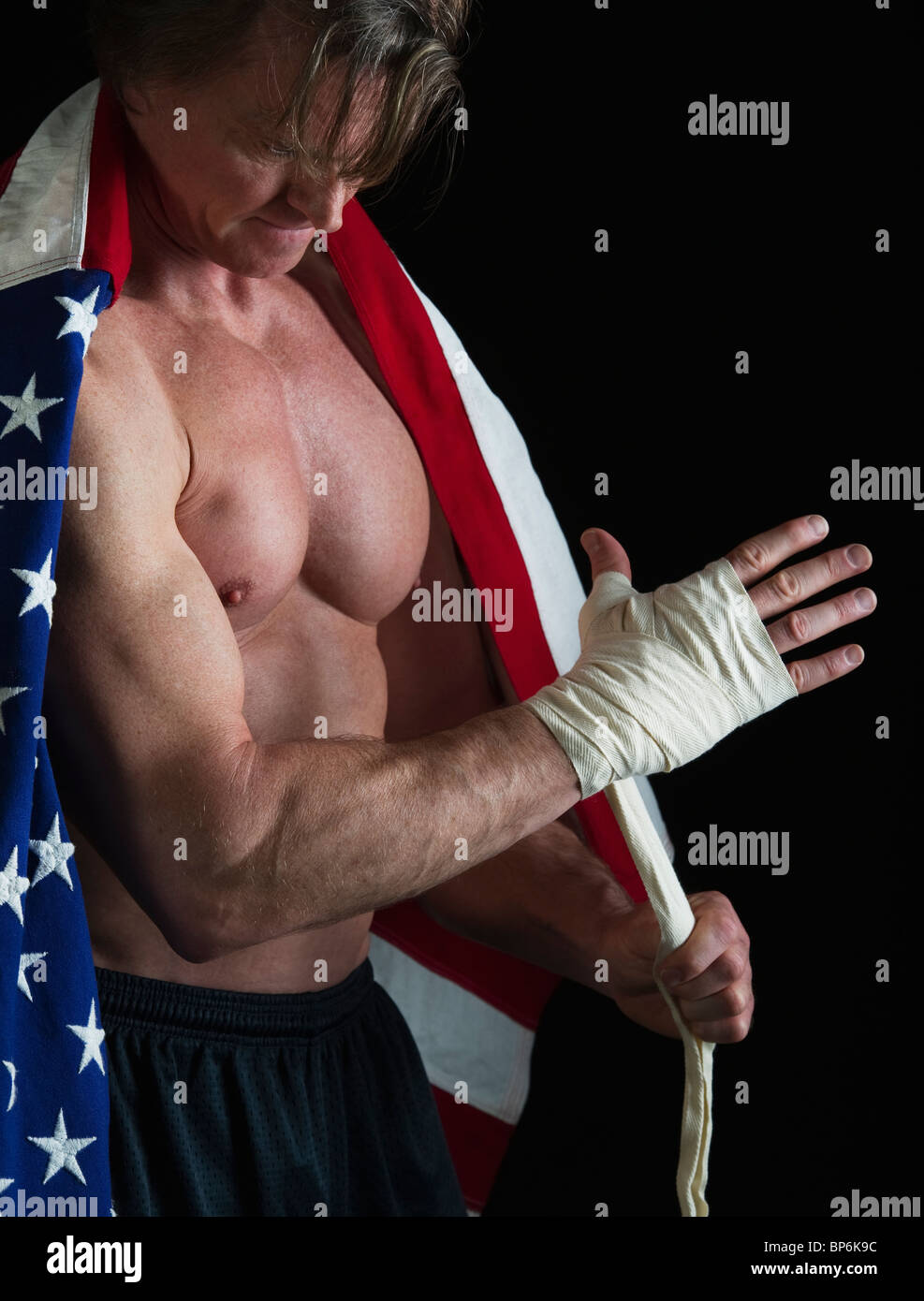 Muscular man wearing American flag as a cape Stock Photo - Alamy