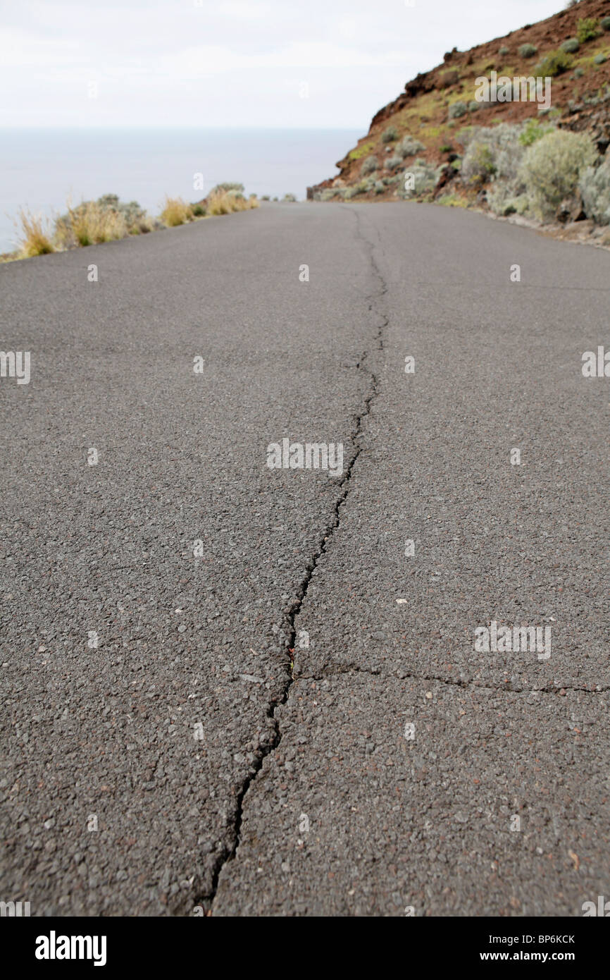 Detail of a crack in a road Stock Photo - Alamy