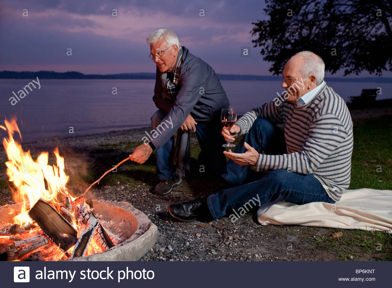 Sitting Beside Fire Stock Photos & Sitting Beside Fire Stock Images - Alamy
