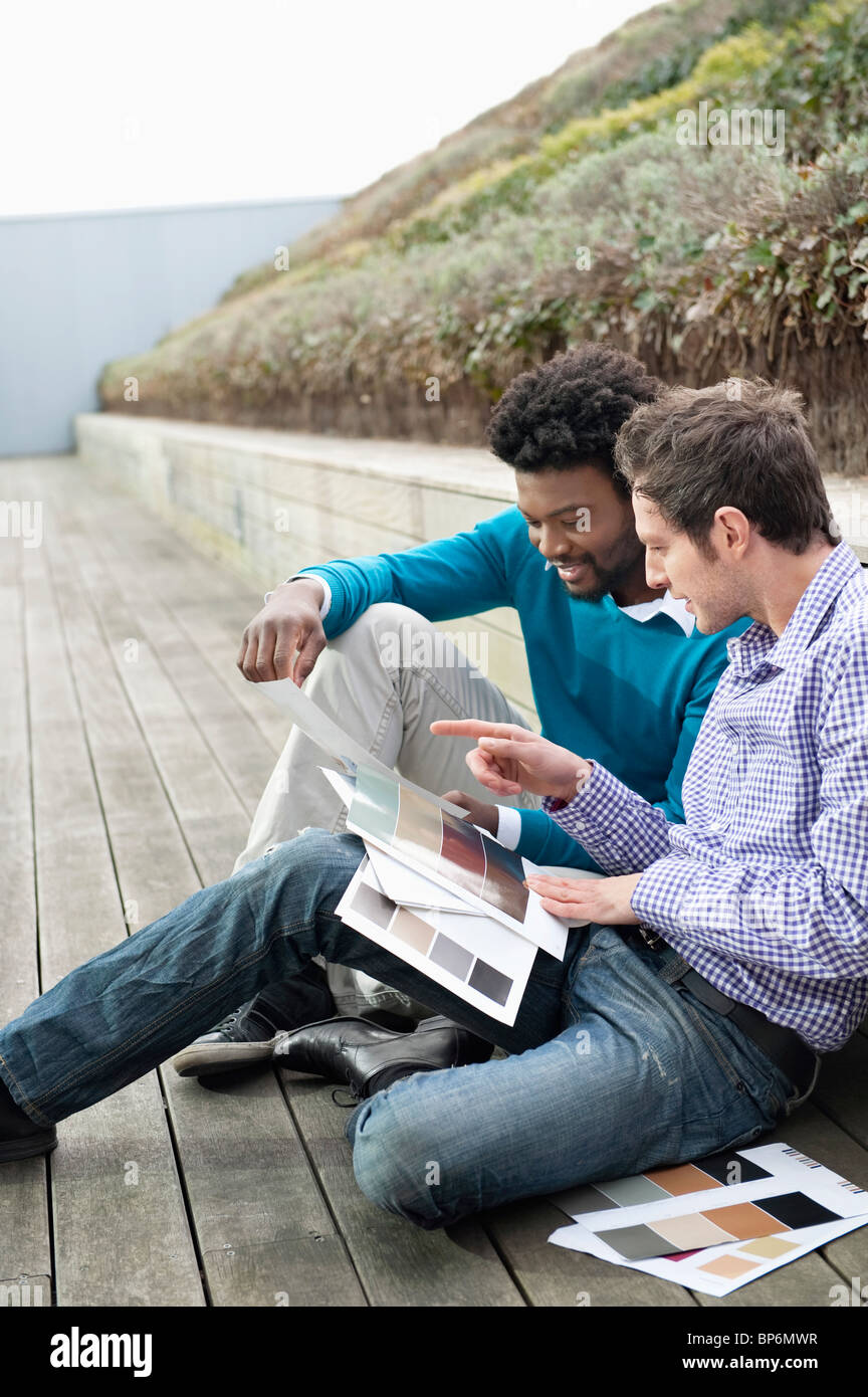 Friends choosing color swatches Stock Photo - Alamy