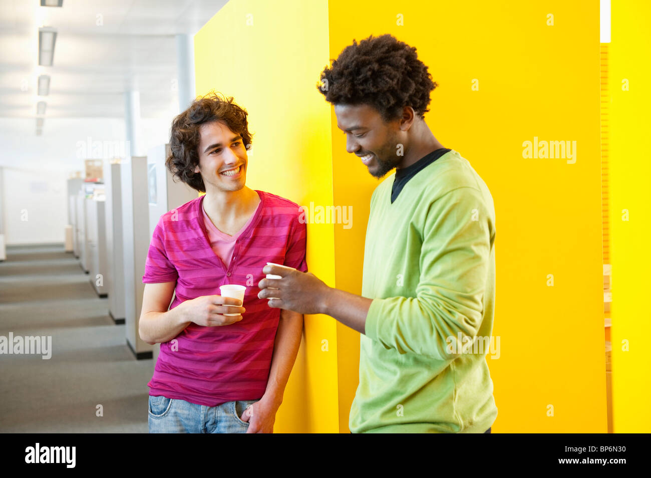 Businessmen drinking tea in an office Stock Photo - Alamy