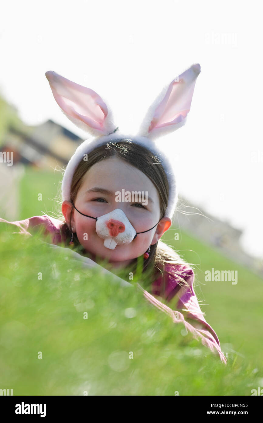 A girl wearing rabbit ears and a mask Stock Photo - Alamy