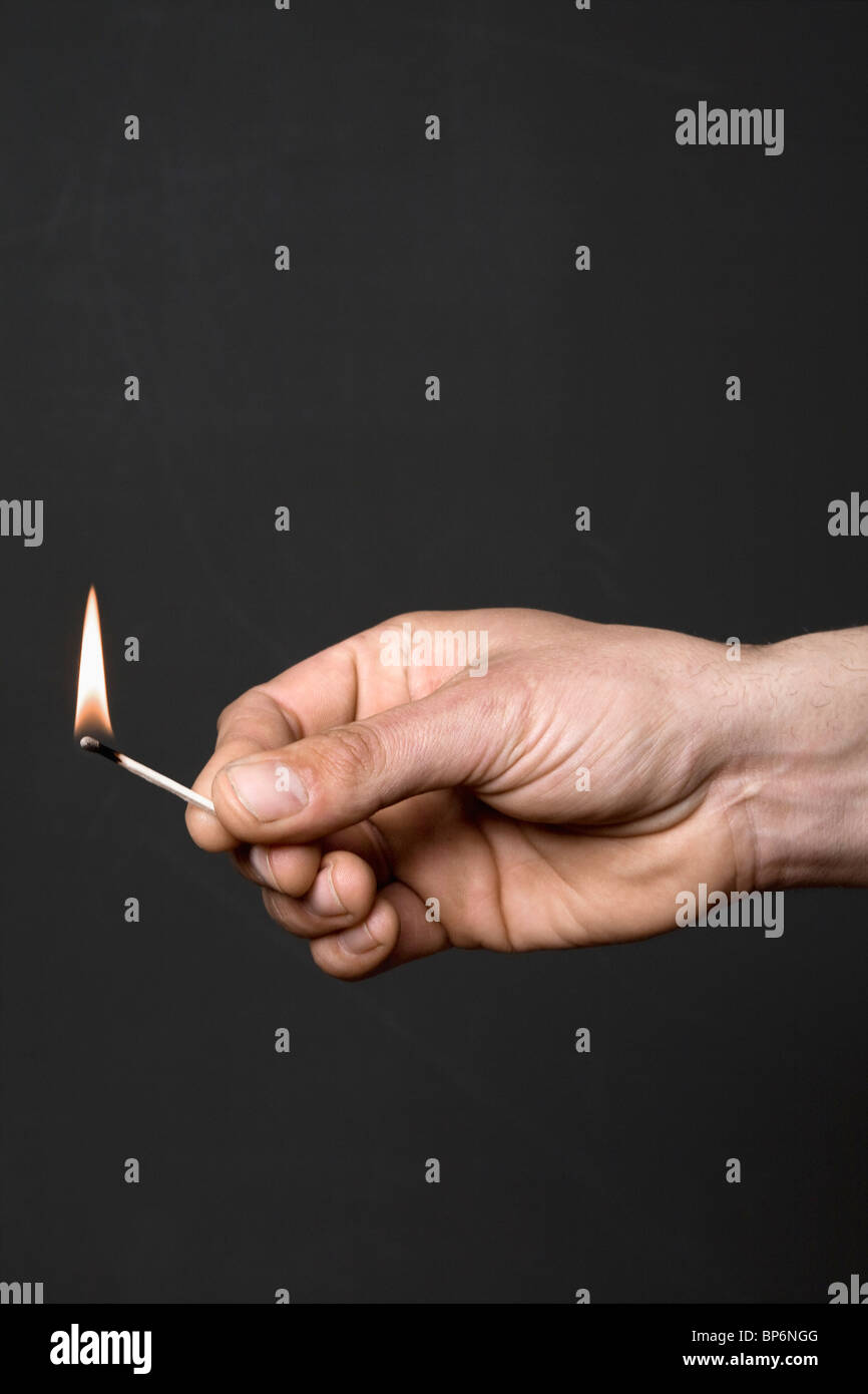 Match hand man lit hi-res stock photography and images - Alamy
