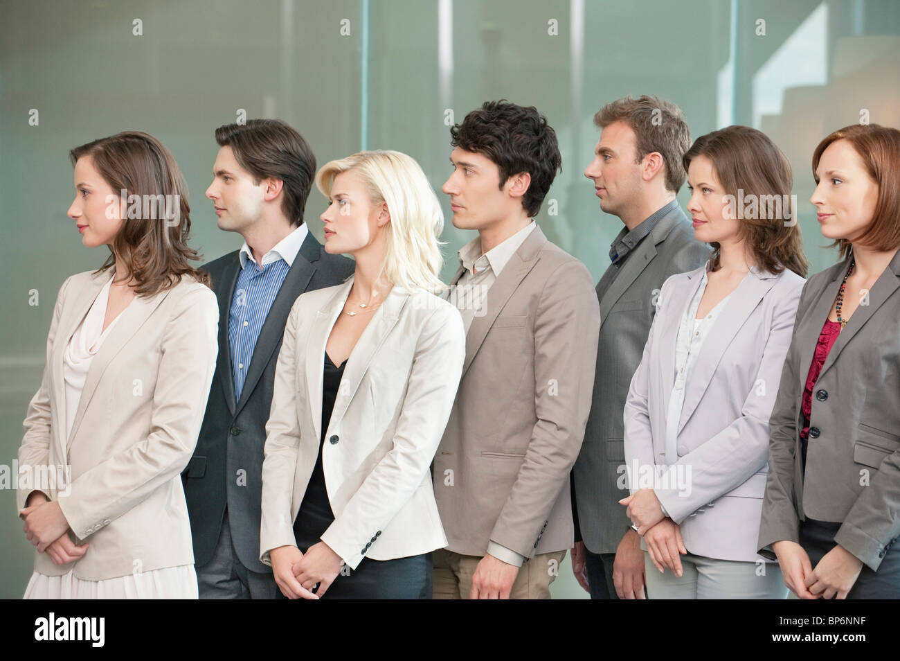 Business people standing side hi-res stock photography and images - Alamy