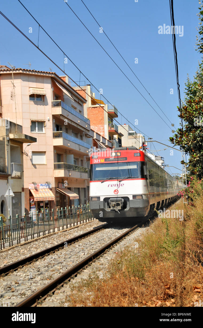 Electric train on its way to Barcelona from sea town resort Calella ...