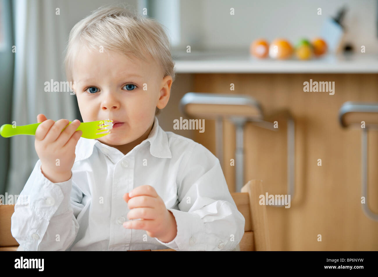 Cute boy holding fork hi-res stock photography and images - Alamy