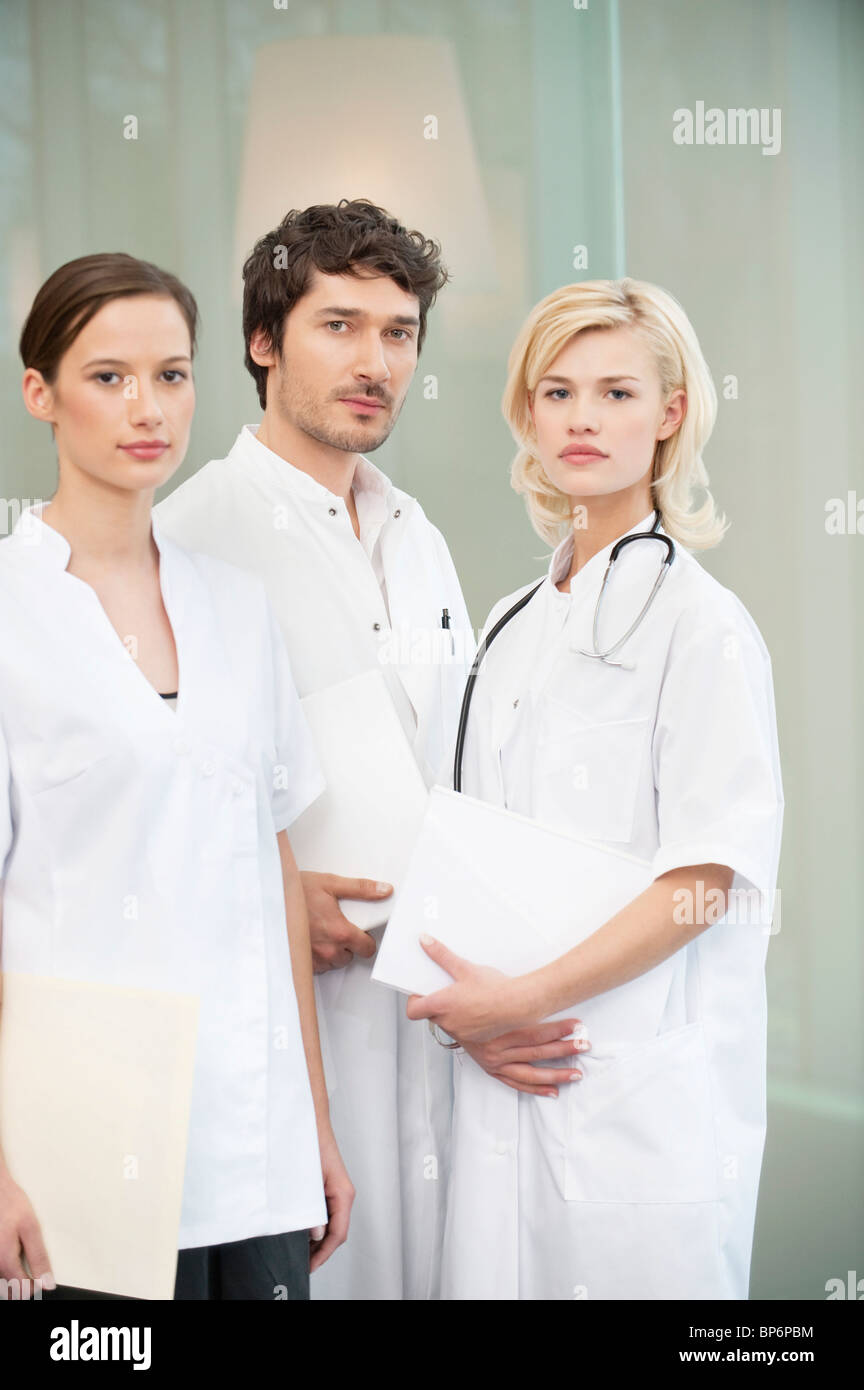 Portrait of three doctors standing together Stock Photo - Alamy