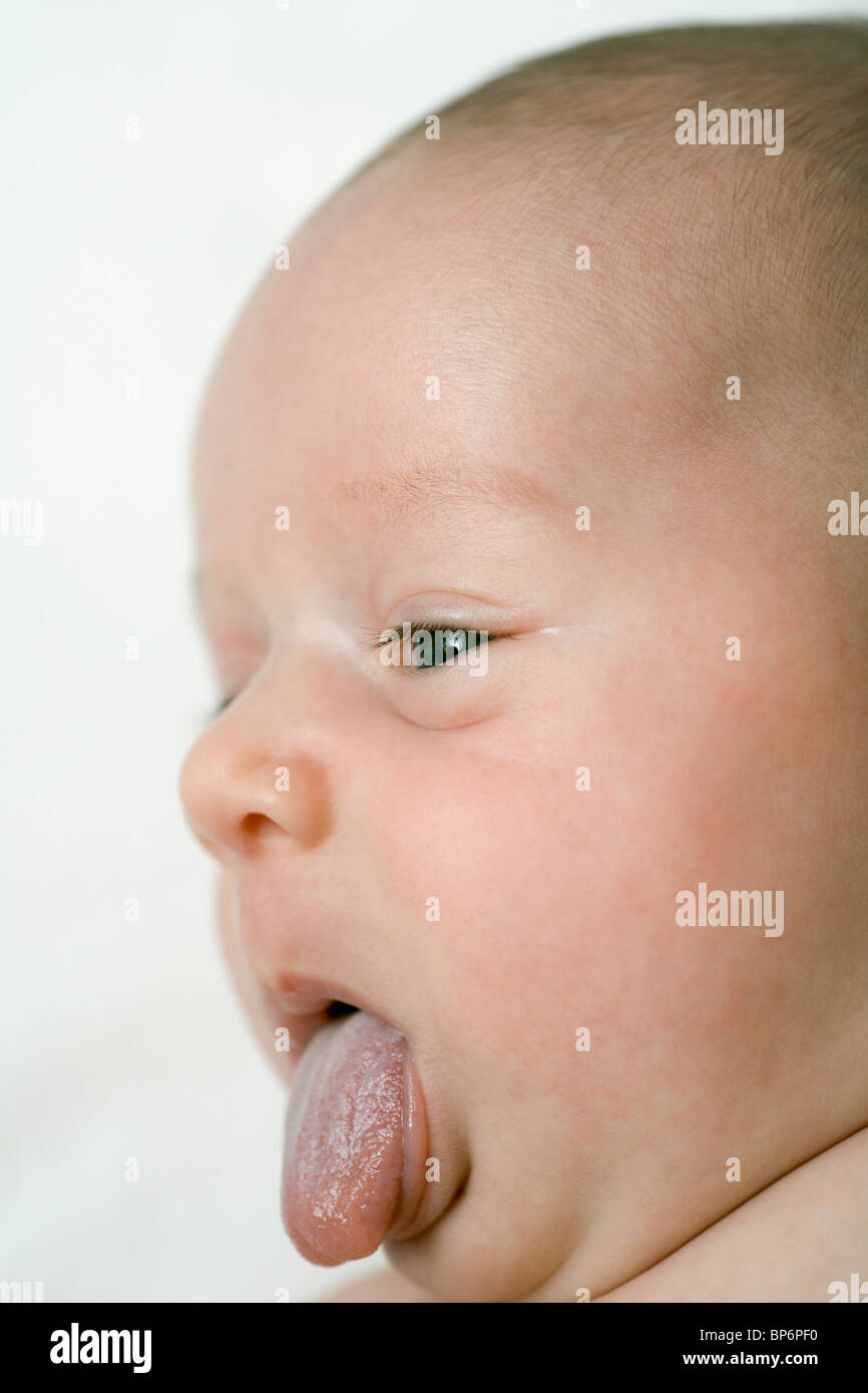 Person sticking tongue out side view hi-res stock photography and images - Alamy