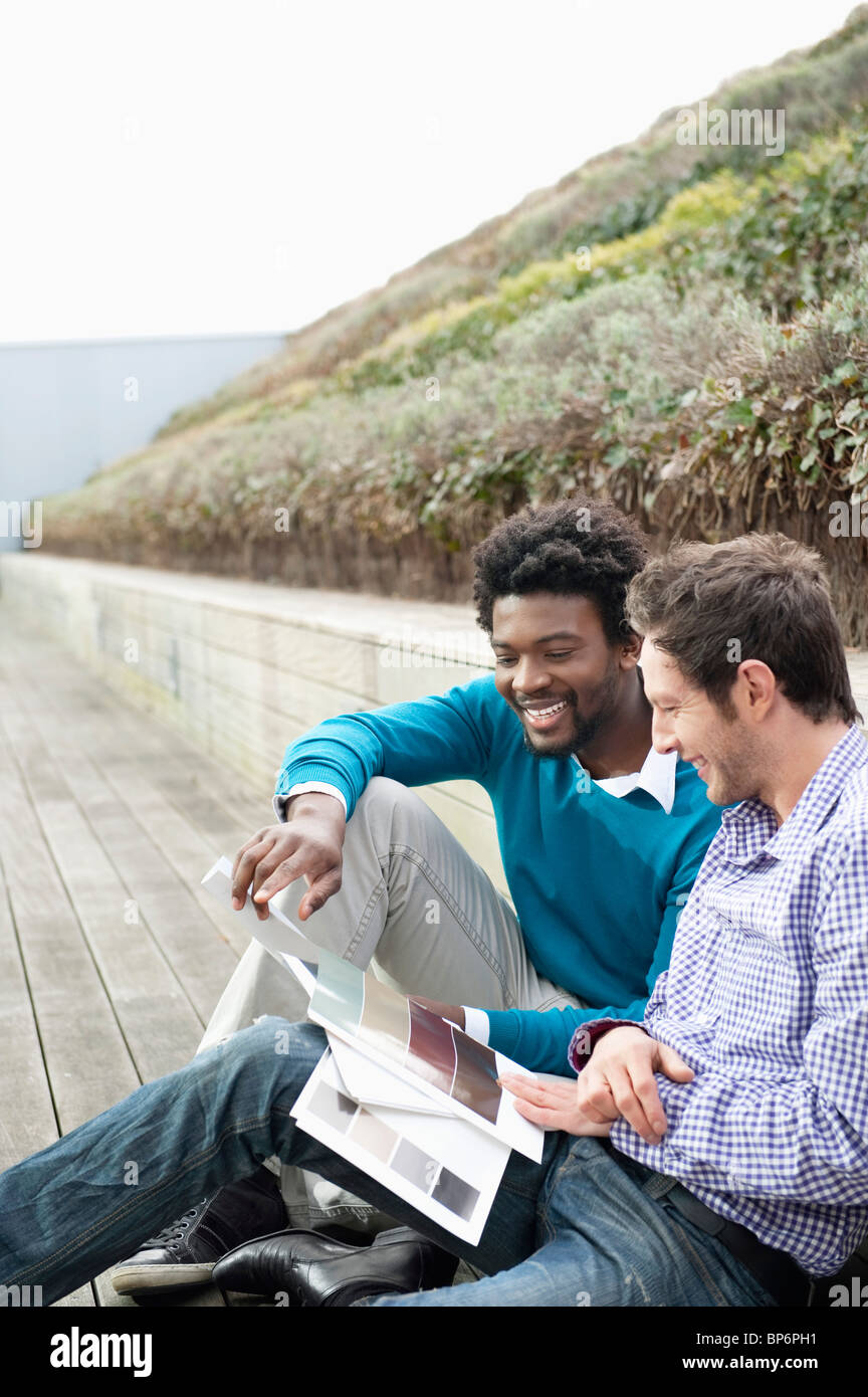 Friends choosing color swatches Stock Photo - Alamy