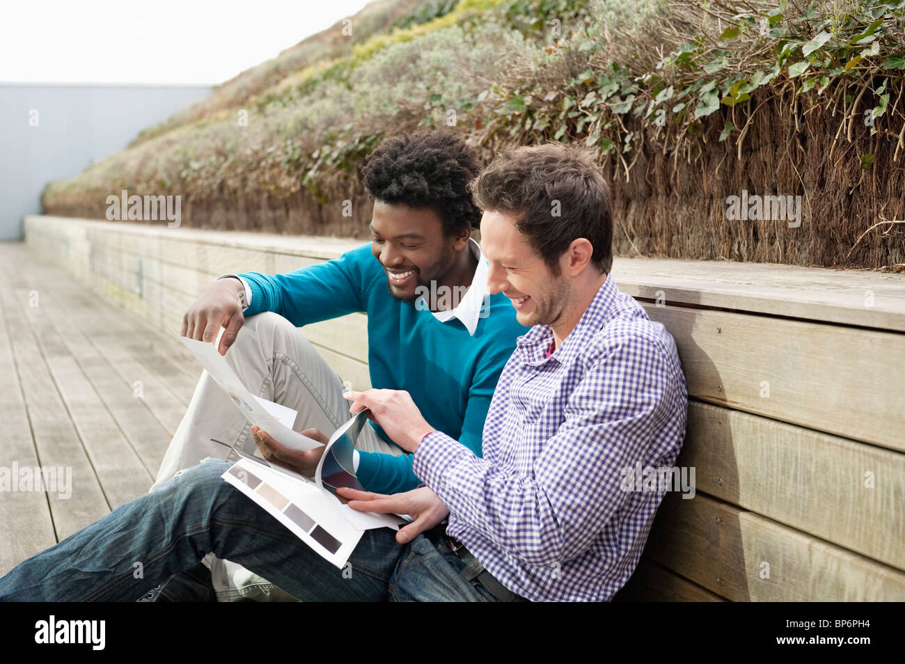 Friends choosing color swatches Stock Photo - Alamy