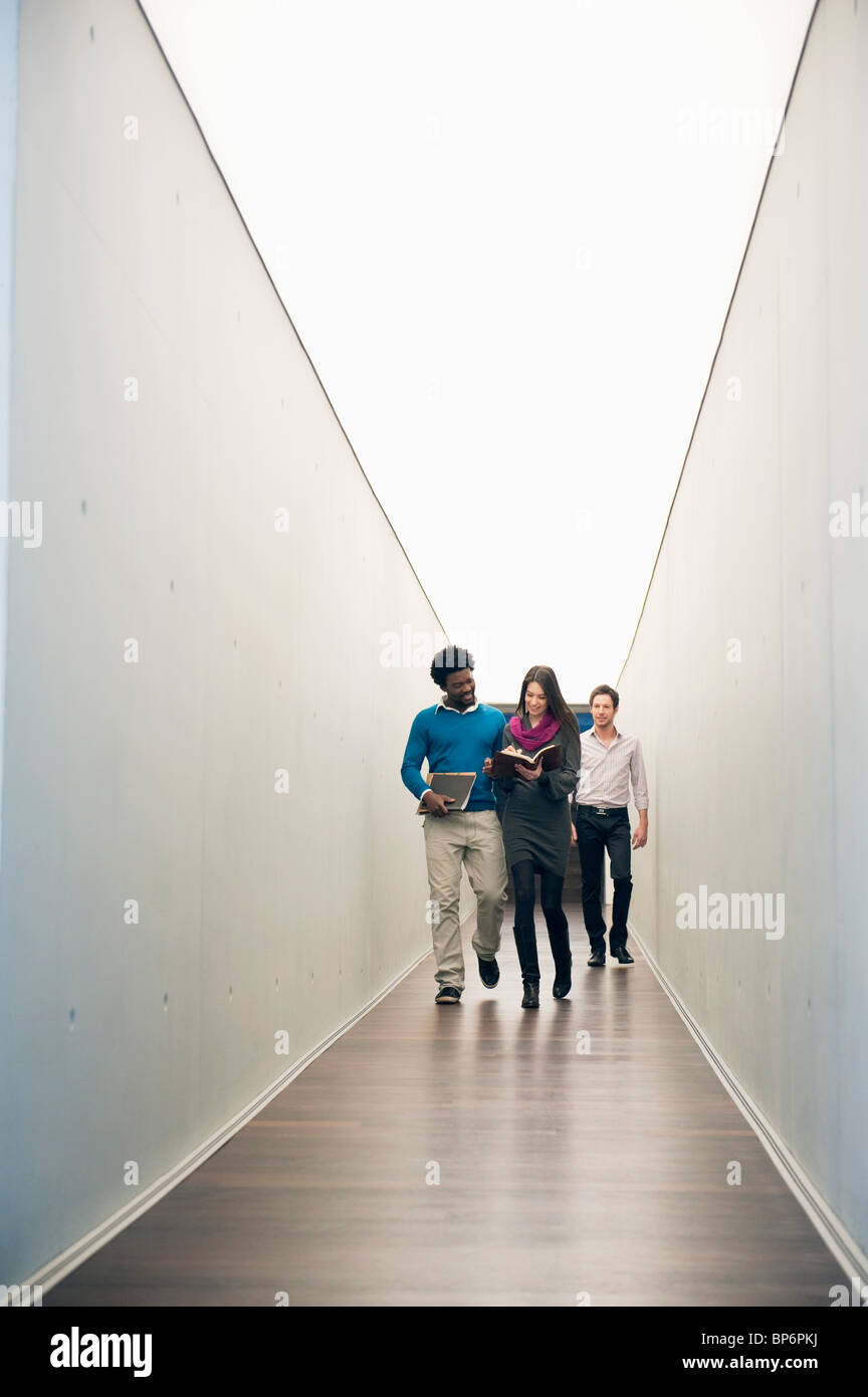 Businesswomen walking in corridor hi-res stock photography and images ...