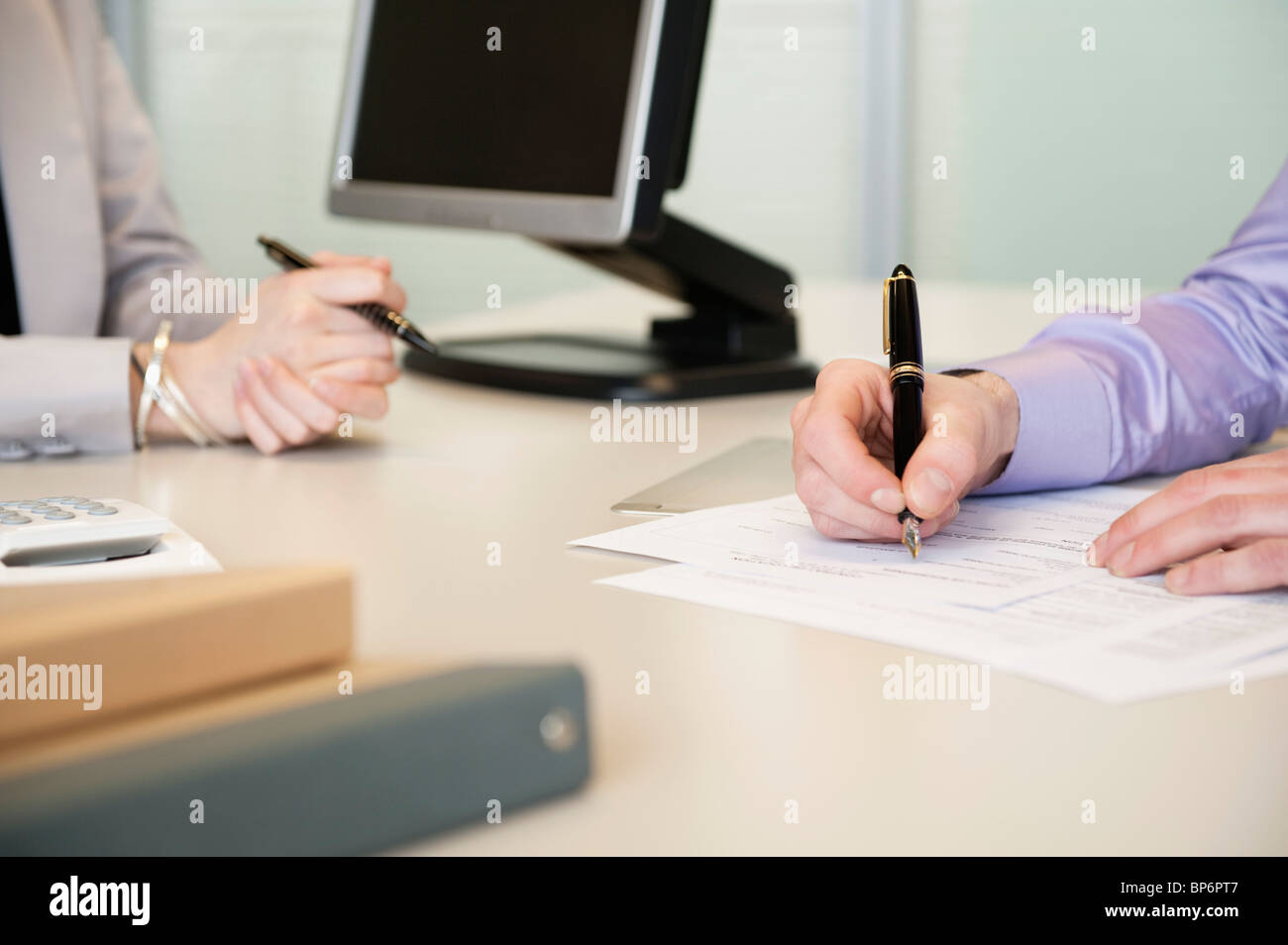 Man signing documents Stock Photo - Alamy