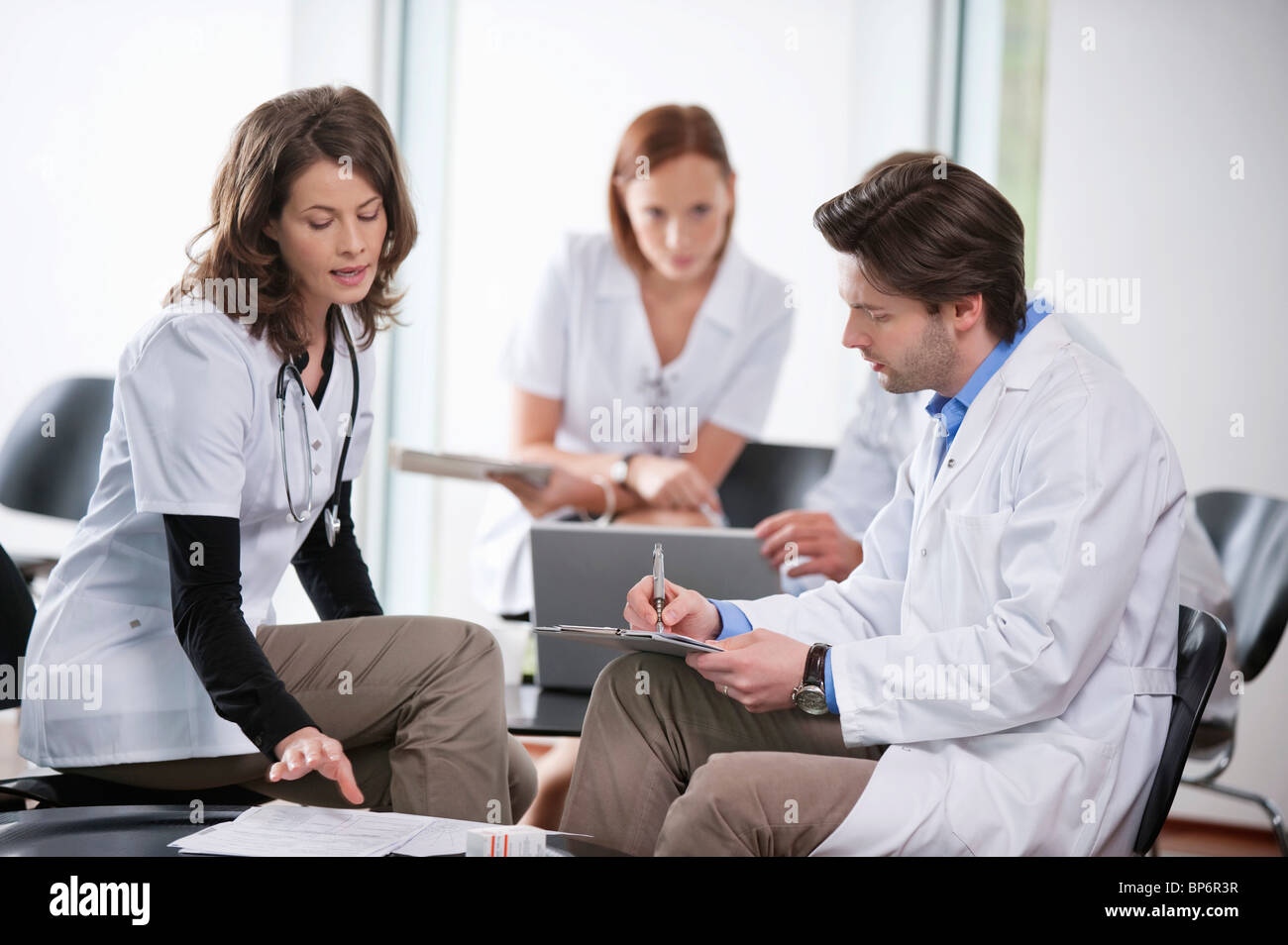 Doctors discussing together Stock Photo - Alamy