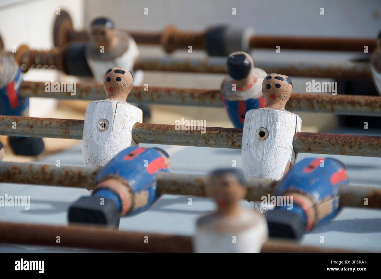 An old foosball table with wooden players, close-up Stock Photo - Alamy