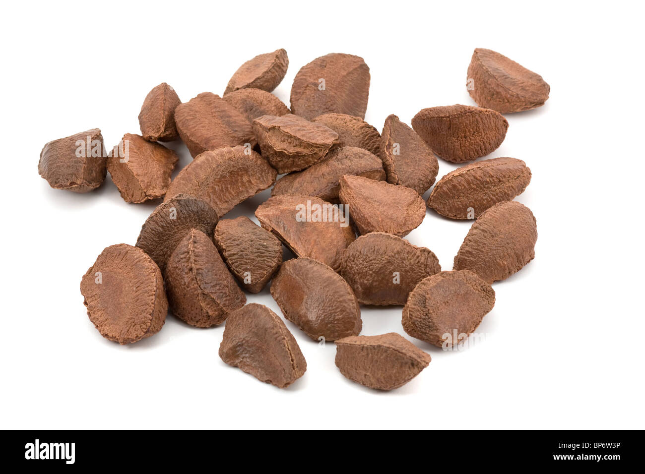 Pile of brazil nuts over white background Stock Photo - Alamy
