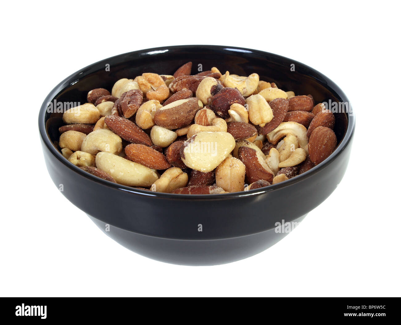 Bowl of deluxe, mixed, salted nuts. Isolated on white Stock Photo - Alamy