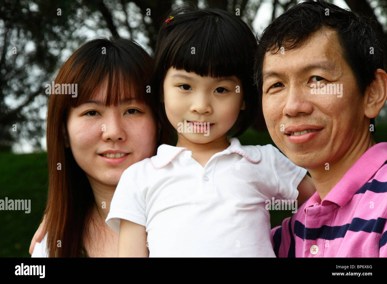 Portrait of a happy Asian family Stock Photo - Alamy