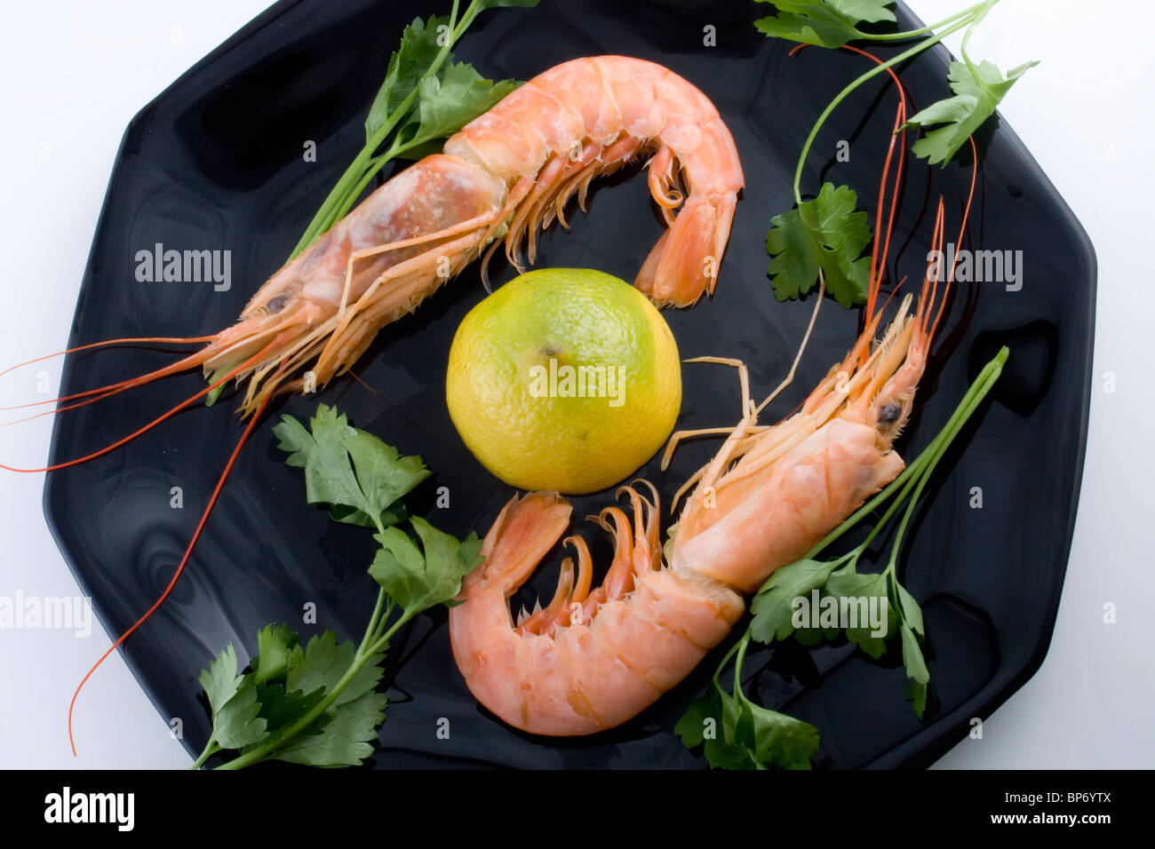 two prawns with lemon Stock Photo - Alamy