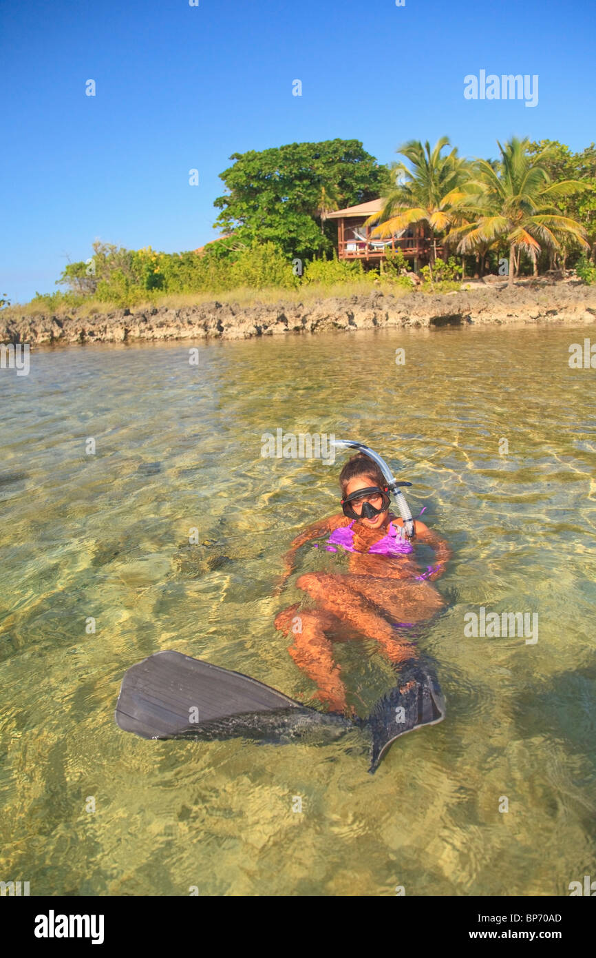 Roatan, Bay Islands, Honduras; A Young Woman Snorkeling At Anthony's ...