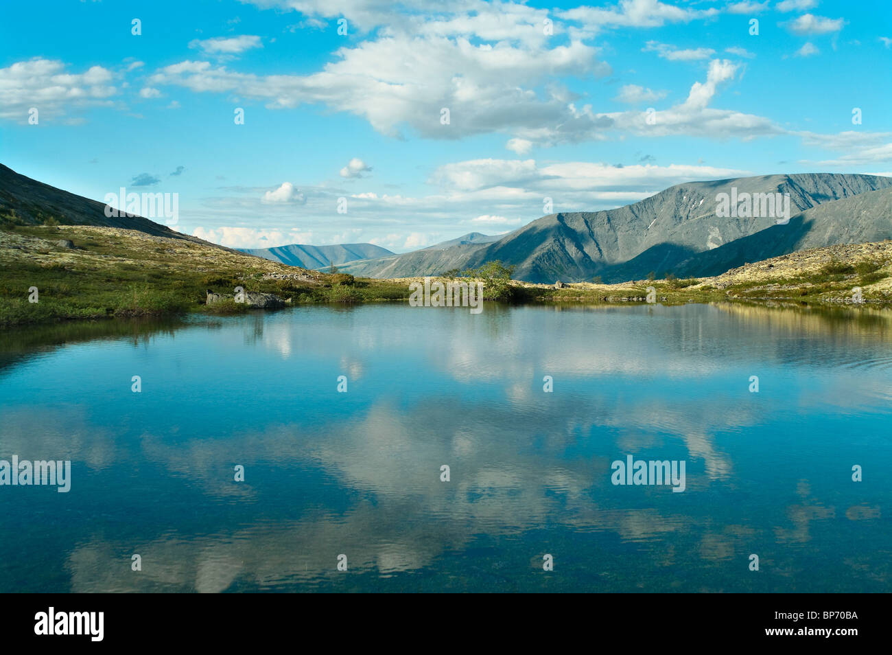 Tranquil mountain lake in morning. Sunrise. The Khibiny Massif, Khibiny ...