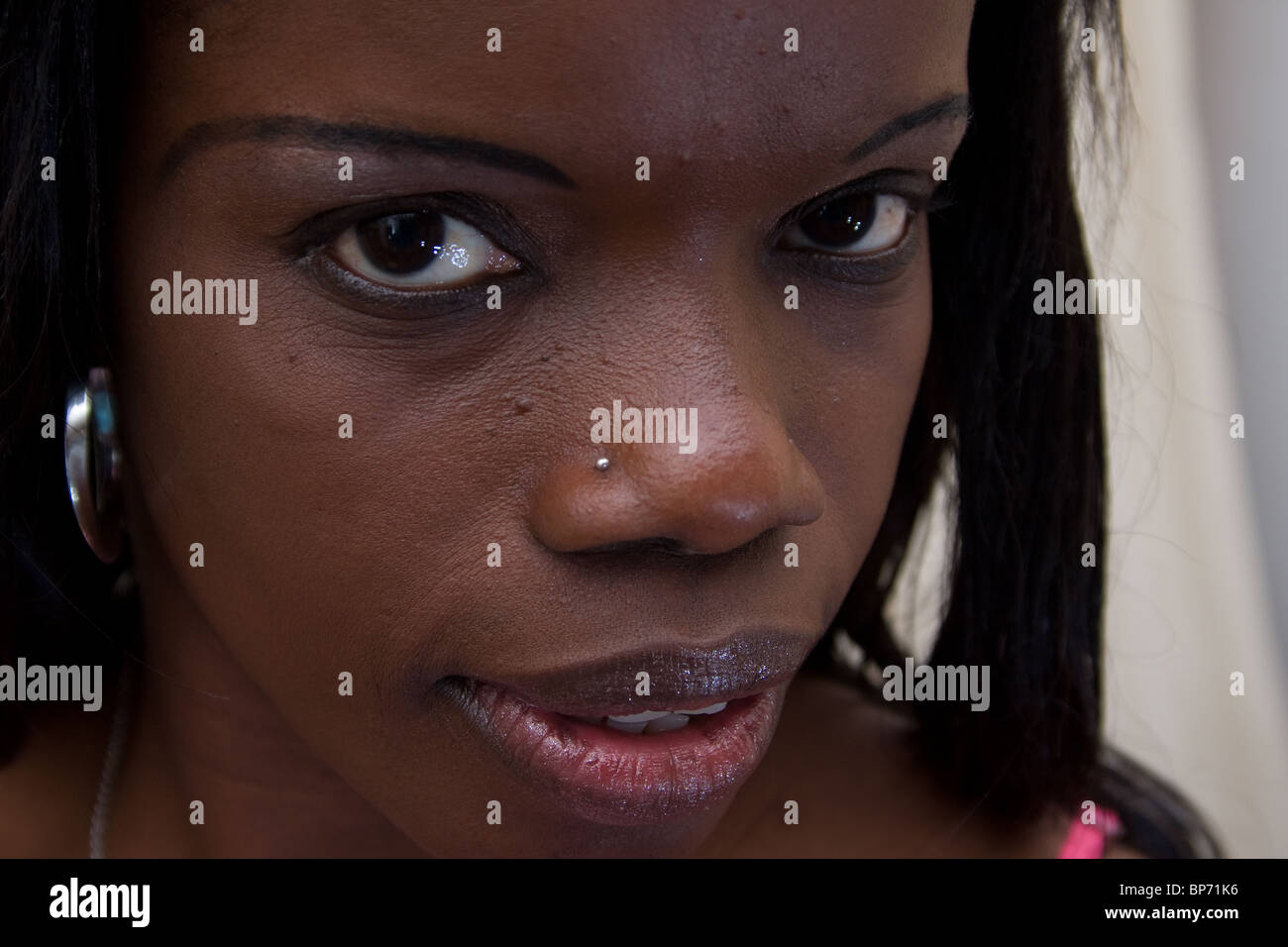 African woman posing smile smiling face female Stock Photo - Alamy