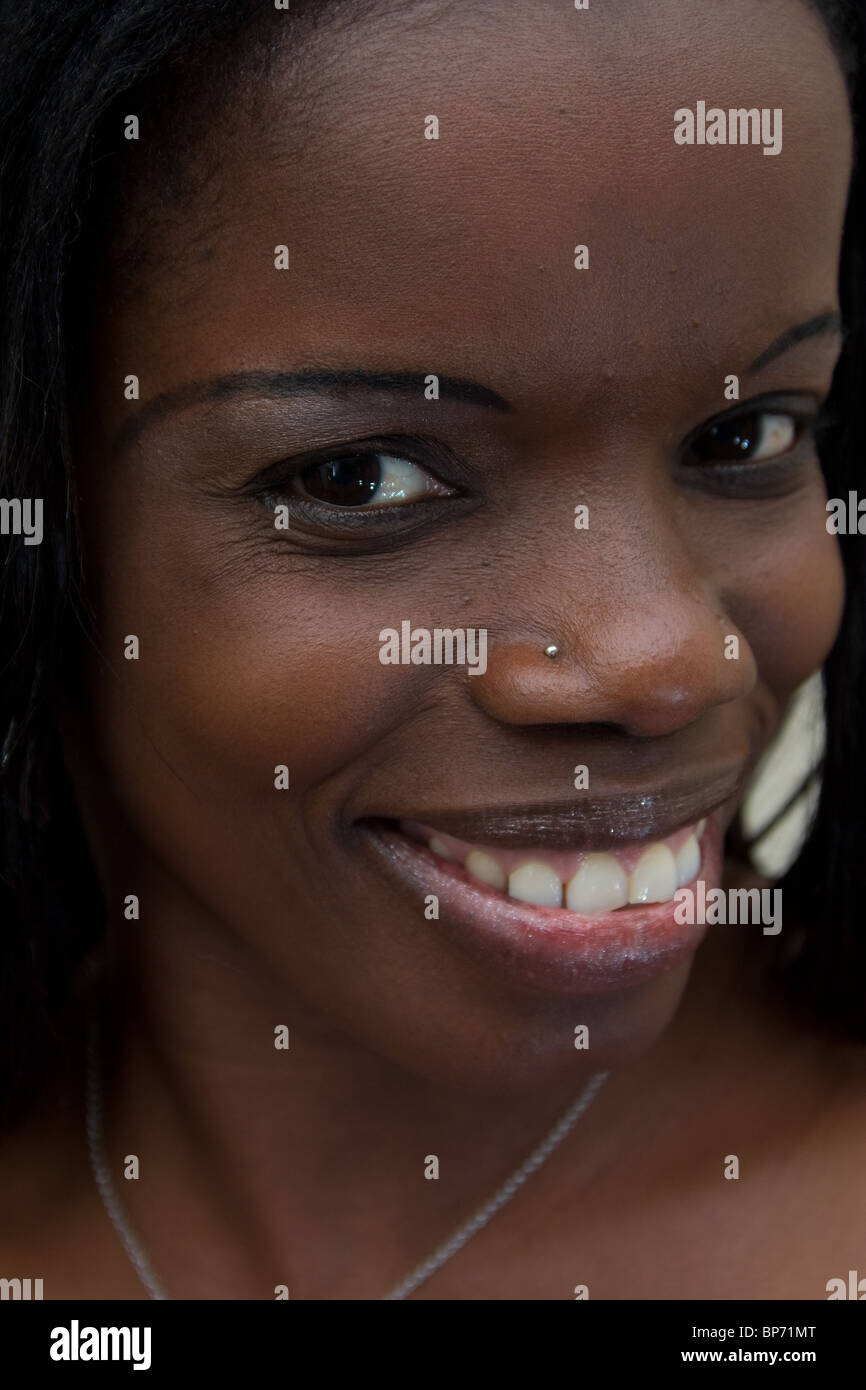 African woman posing smile smiling face female Stock Photo - Alamy