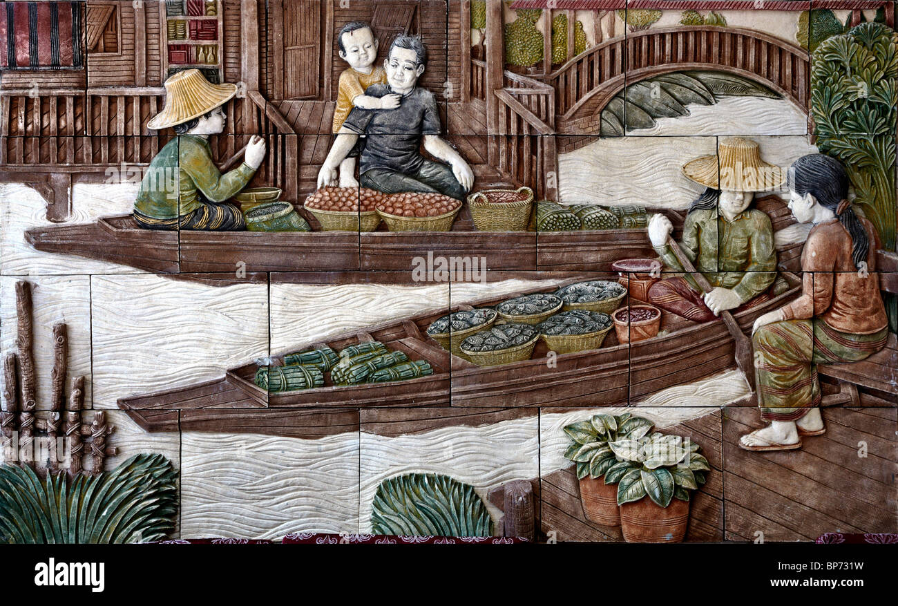 Base relief wall plaque of a traditional Thai rural village scene ...