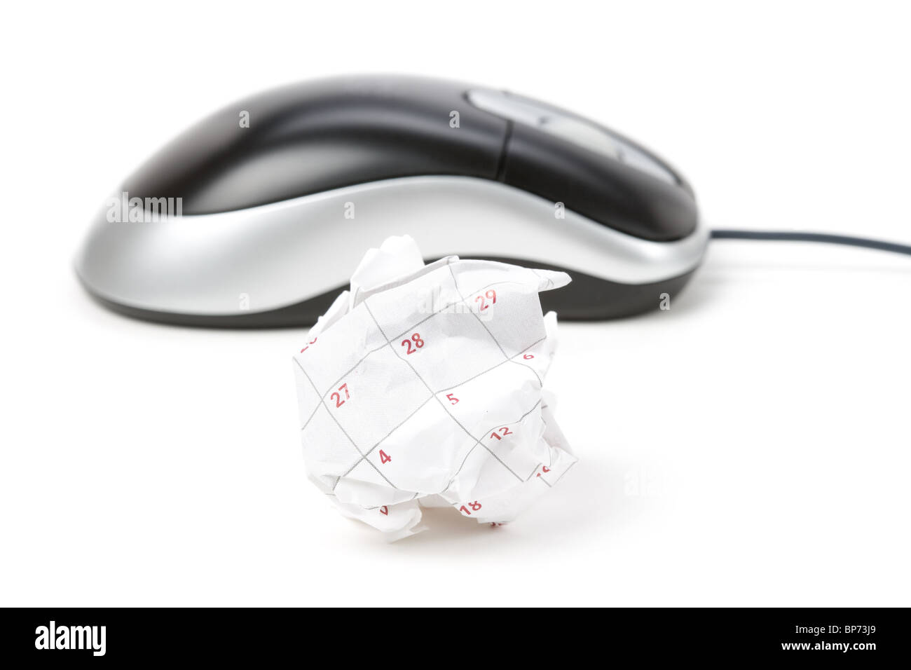 Calendar paper ball and computer mouse, concept of time planning ...