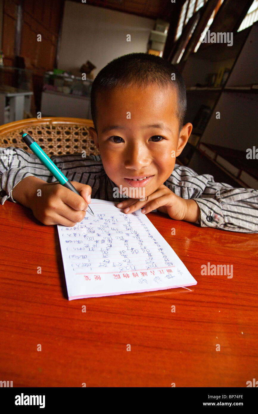 Chinese boy writing in Chinese, Lijiang, Yunnan Province, China Stock ...
