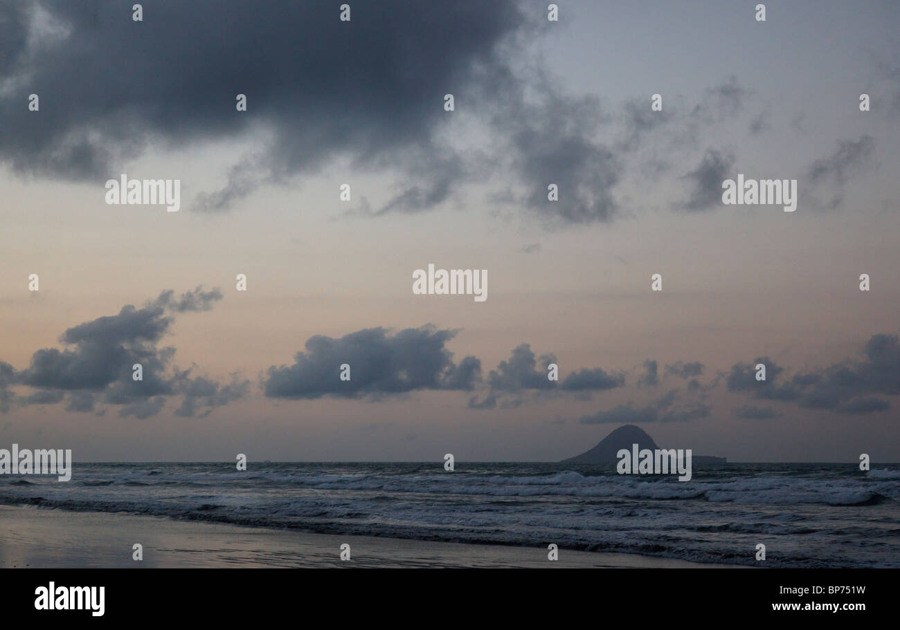 A sunset over Ohope Beach with Whale Island and the moon in the ...