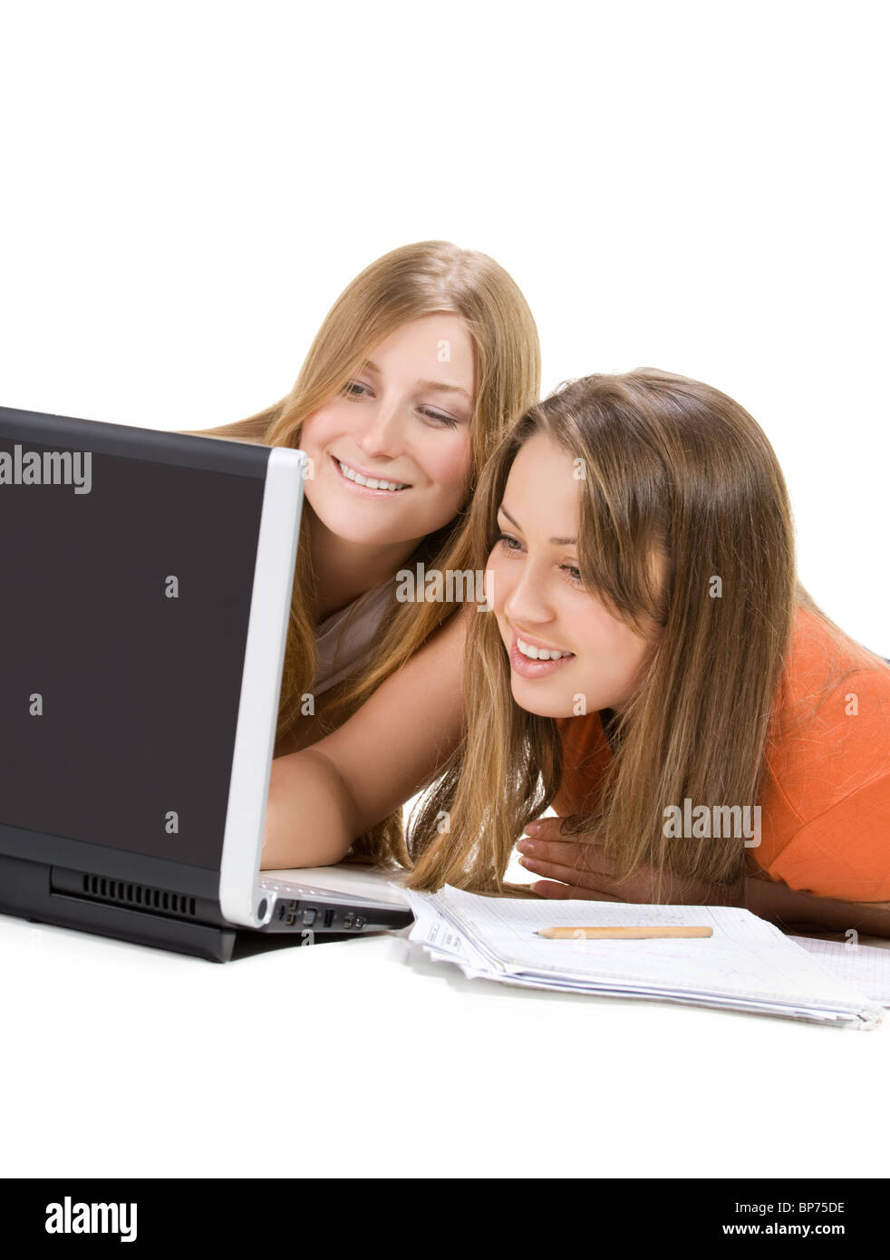 two young happy student girl work on laptop computer isolated on white ...