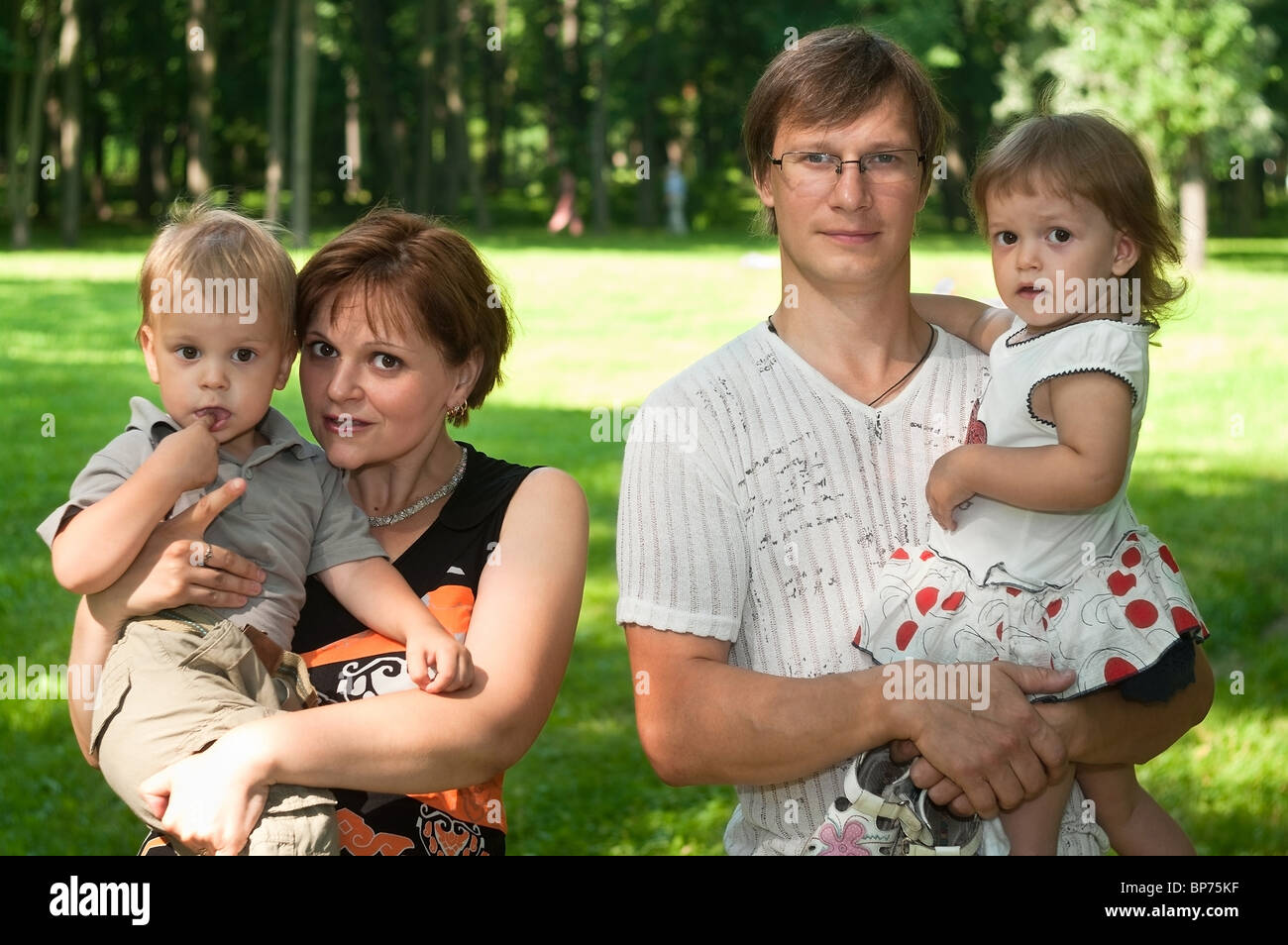 Happy family of four people. Two adult parents and two children Stock ...
