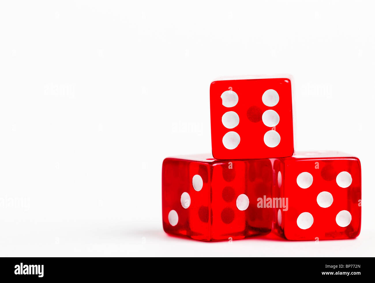 three red dices on white background Stock Photo - Alamy