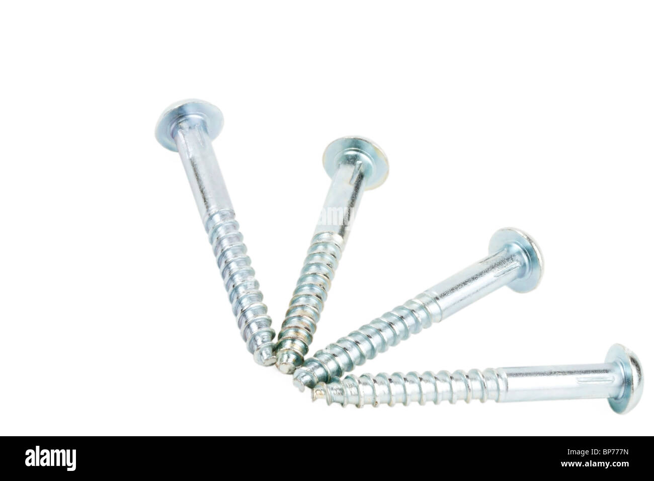 four silver wood screws isolated on white background Stock Photo - Alamy