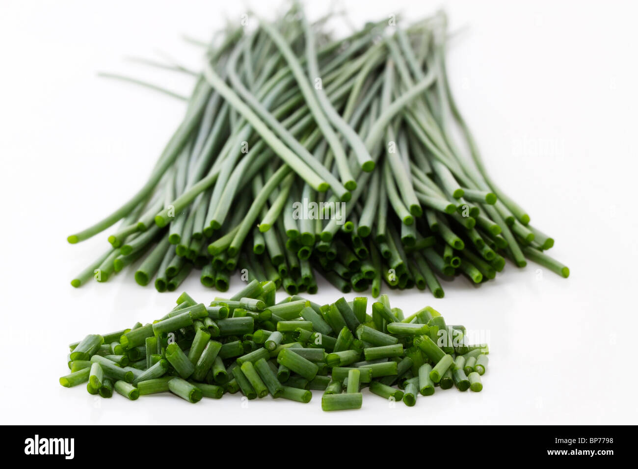 chopped chives isolated on white background Stock Photo - Alamy